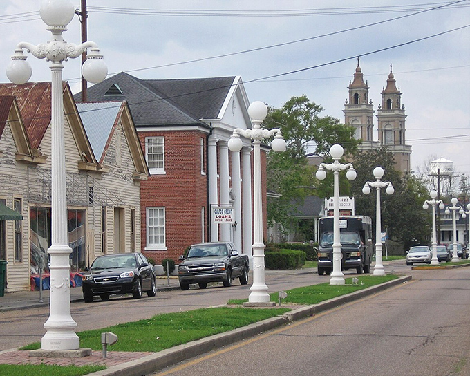 Historic Franklin's charming Main Street features elegant white lamp posts, classic architecture, and church spires in the distance.