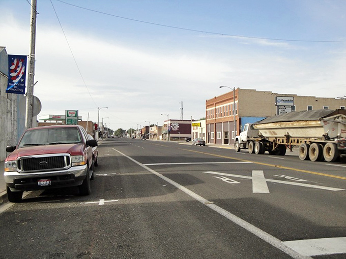 Main Street stretches ahead with the promise of unhurried conversations and genuine neighborly waves.