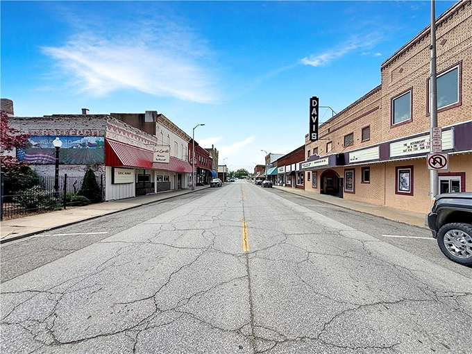Historic downtown Higginsville showcases charming brick buildings and a classic small-town theater under bright Missouri skies.