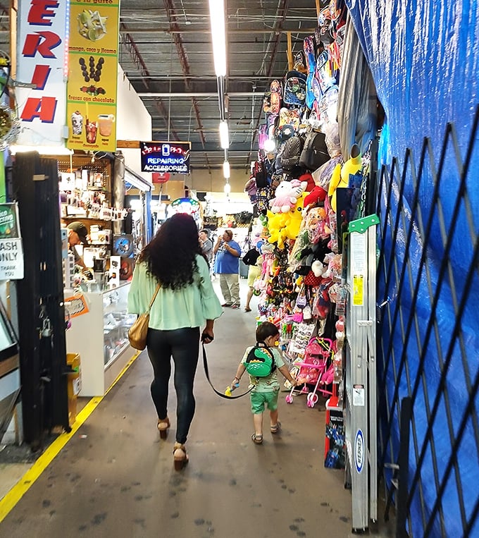Family shopping adventure! A parent and child explore Houston Flea Market's endless aisles of toys, trinkets, and unexpected treasures.