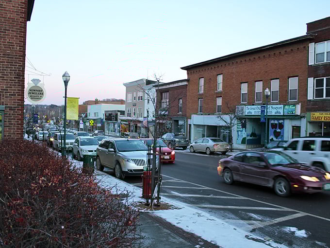 The marina whispers promises of summer adventures while mountains stand guard in the distance. Newport's daily backdrop beats any Zoom background.