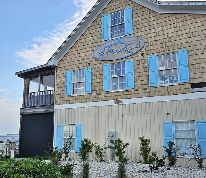 Those blue shutters aren't just for show &ndash; they frame a coastal experience where seafood takes center stage against a backdrop of small-town charm.