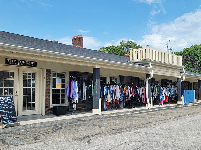 Clothing racks spill onto the sidewalk, offering a sneak peek of The Toggery's fashionable treasures within.