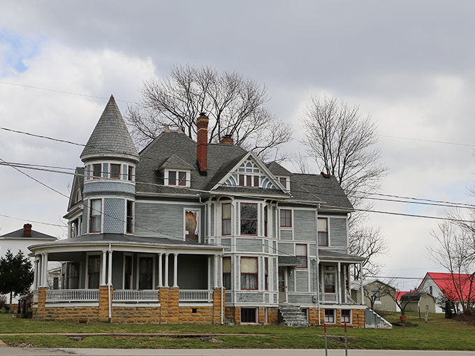 Historic Victorian mansion in West Union showcases classic architectural details with its distinctive turret and wraparound porch.