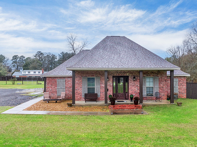 This isn't just a house&mdash;it's the Louisiana dream in brick form, complete with covered porch perfect for sweet tea sipping and neighborhood watching.