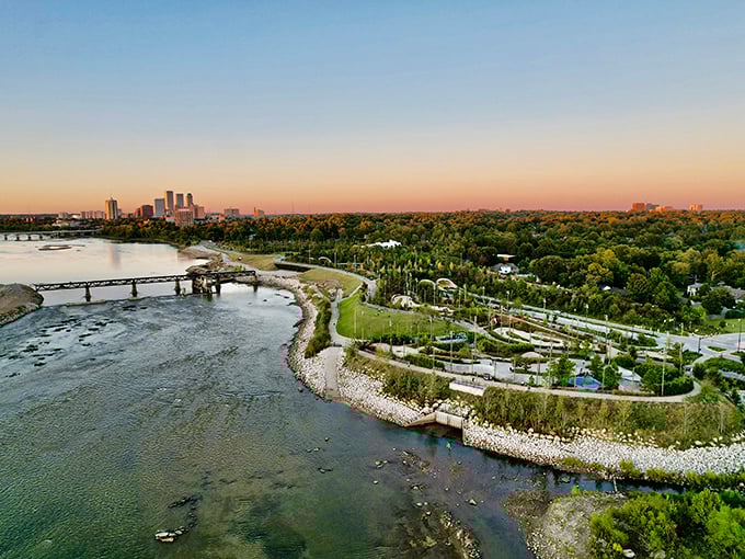 The Arkansas River curves gracefully past Gathering Place park, nature's way of saying "slow down and enjoy the view, would ya?"