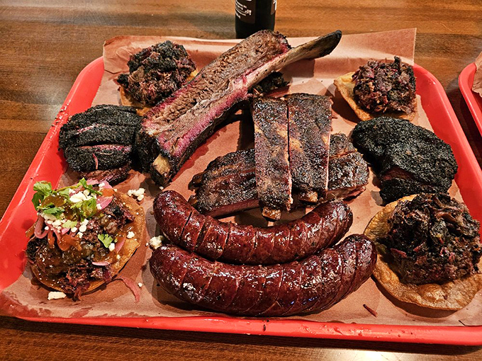 Behold the carnivore's dream team&mdash;ribs, brisket, and sausage sharing a tray like the all-star band you never knew you needed.