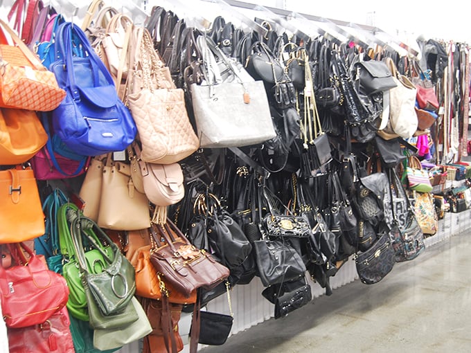 Handbag heaven! Like a leather and vinyl garden where purses of every era bloom in organized chaos.