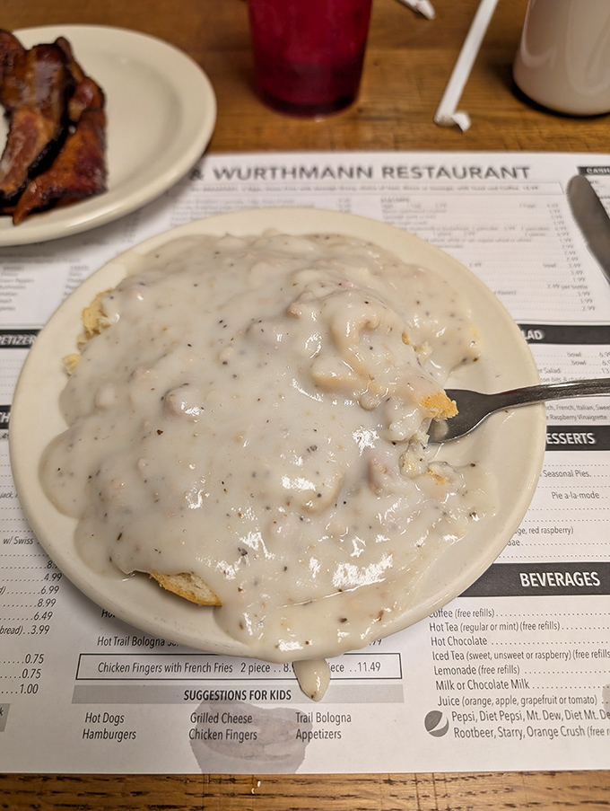Behold: biscuits and gravy that would make your grandmother both jealous and proud. That spoon is about to embark on a journey of epic proportions.