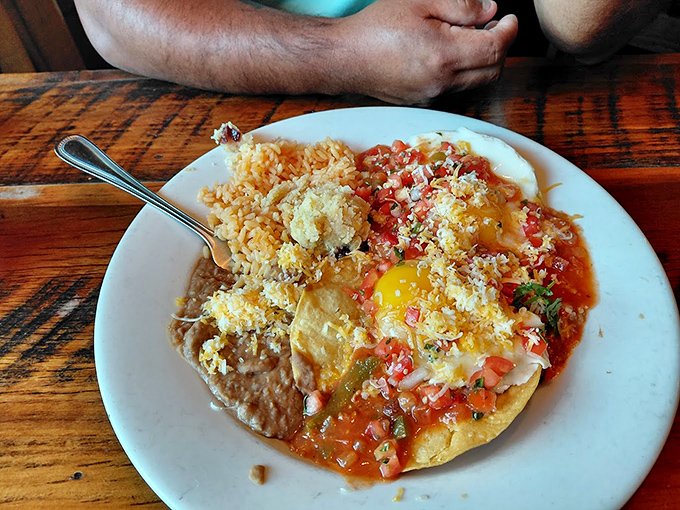 Huevos rancheros that could make a rooster crow with delight. The perfect marriage of eggs, salsa, and cheese atop a golden tortilla.