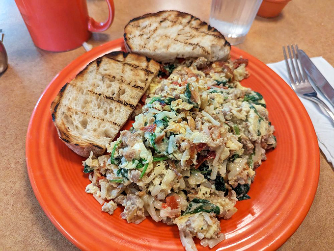 This isn't just a scramble, it's a morning masterpiece—where eggs, veggies, and toast conspire to make you forget all about that 8 a.m. meeting.