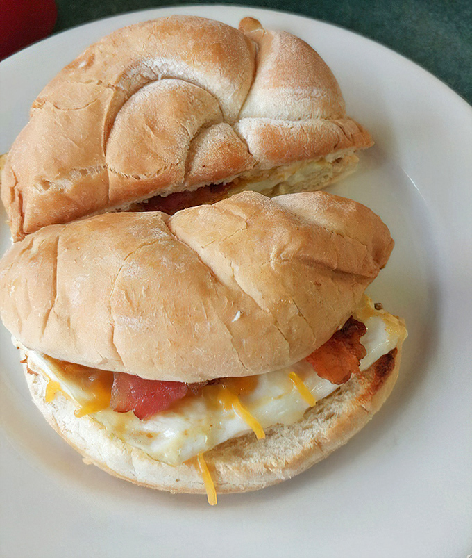 The breakfast sandwich that launched a thousand food comas – eggs, cheese, and bacon nestled in a croissant that means business.