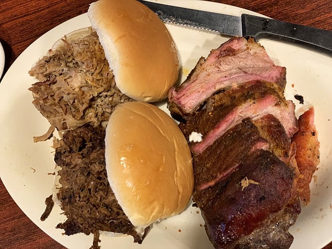 Behold the holy trinity of barbecue bliss: pulled pork, fresh buns, and brisket with that telltale pink smoke ring that makes meat lovers weak in the knees.