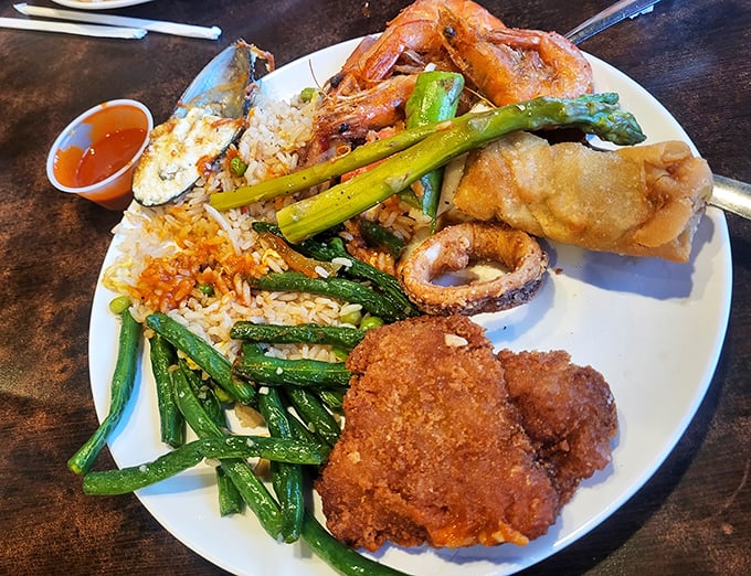 The ultimate choose-your-own-adventure plate: crispy fried chicken, tender green beans, and seafood that would make coastal restaurants envious.