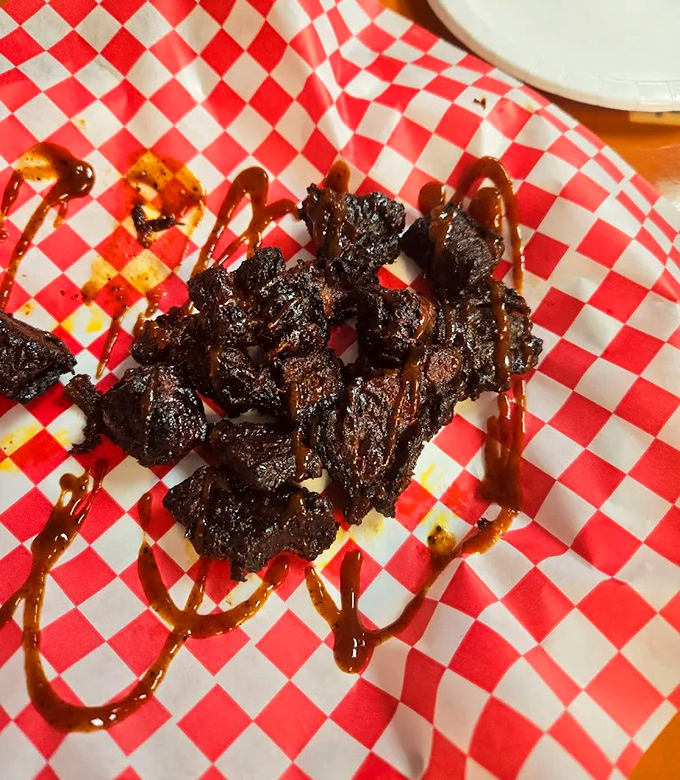 Burnt ends: where barbecue transcends to art form. These glistening morsels of caramelized brisket are what food dreams are made of.