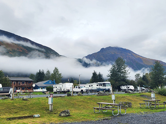 Wait&mdash;this isn't Seward! This appears to be a mountain campground scene with RVs parked against a dramatic misty mountain backdrop.