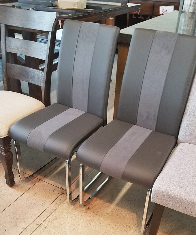 These sleek dining chairs prove affordable doesn't mean boring &ndash; their chrome bases and two-tone upholstery would elevate any dinner party.