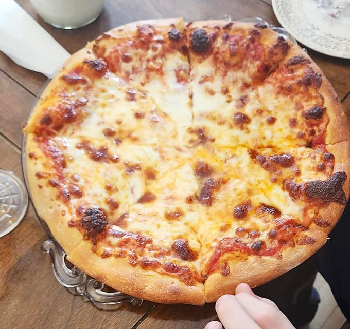 Pizza perfection doesn't need to shout. This beautifully blistered cheese pie whispers sweet nothings to your taste buds instead.