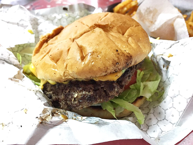 This isn't just a cheeseburger&mdash;it's a masterpiece of beef, cheese, and fresh toppings that demands to be photographed before it's devoured.