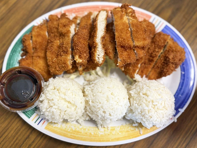 Chicken katsu that achieves the perfect crunch-to-tenderness ratio, served with the traditional trio of rice scoops—Hawaii's comfort food at its finest.