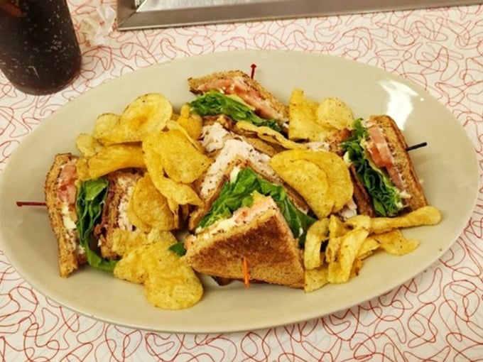 Not just a sandwich but an architectural achievement &ndash; layers of goodness with potato chips as the perfect sidekick.