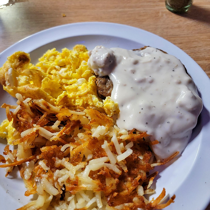 Breakfast of champions: golden hash browns, fluffy scrambled eggs, and country-fried steak smothered in gravy that could make a vegetarian reconsider.