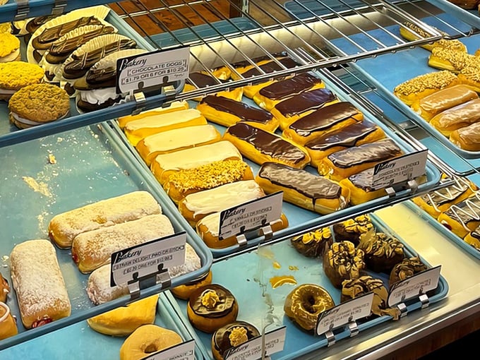 The display case&mdash;where diet plans come to die and happiness is measured in layers of cream filling and chocolate glaze.