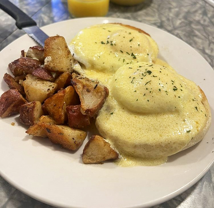 Eggs Benedict that would make a French chef weep with joy&mdash;perfectly poached eggs draped in hollandaise that's rich enough to apply for its own bank account.