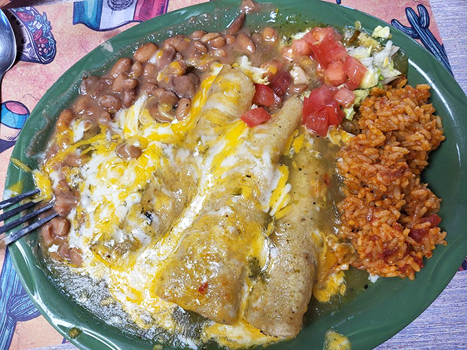 Green chile enchiladas that make time stand still. That perfect cheese-to-sauce ratio is what food dreams are made of.