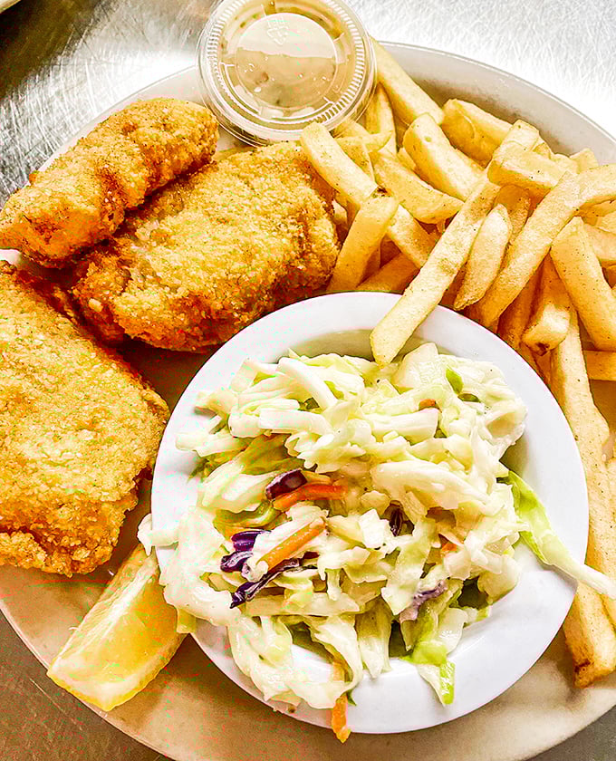 Golden-battered fish, perfectly crisp fries, and fresh coleslaw&mdash;this is the holy trinity of fish and chips that keeps locals coming back.