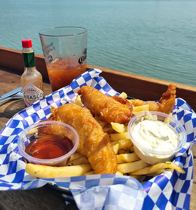 Waterfront fish and chips: golden, crispy batter hugging tender white fish, with the bay as your dining companion. Tabasco optional, view mandatory.