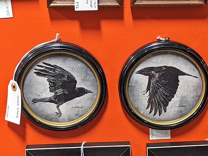 These framed ravens against vibrant orange aren't just wall art&mdash;they're gothic poetry for people who prefer their Edgar Allan Poe in visual form.