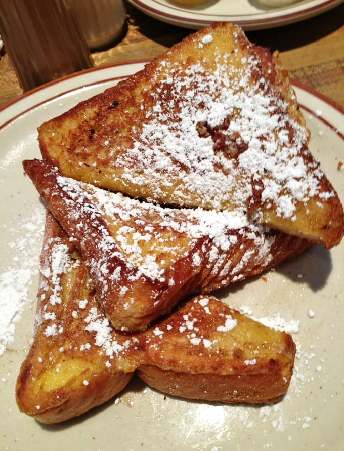 French toast dusted with powdered sugar like fresh snow, because sometimes breakfast needs to look as good as it tastes.