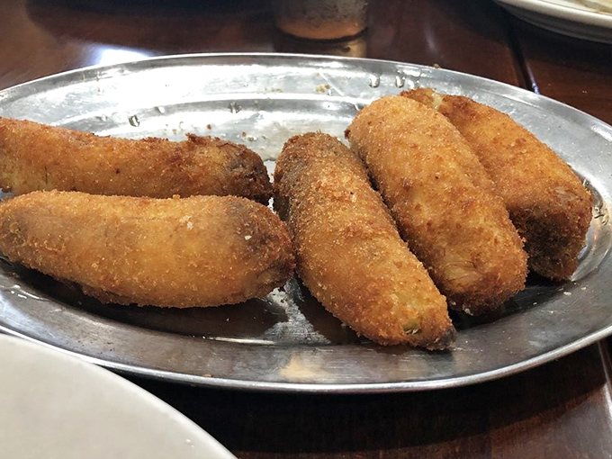 These golden-brown croquettes aren't just appetizers&mdash;they're edible ambassadors of the kitchen's commitment to perfect frying technique. Crispy outside, steamy inside.