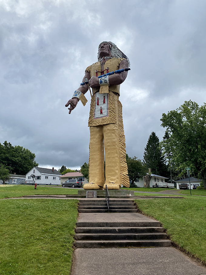 Hiawatha stands tall against the Michigan sky, a 52-foot testament to the region's Native American heritage and a quirky roadside attraction worth the stop.