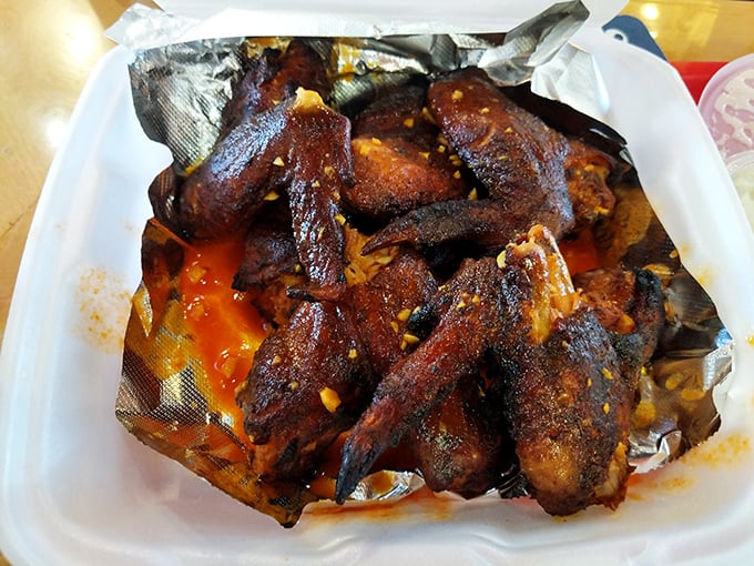 These aren't your average wings. That mahogany color comes from hours of hickory smoke, not a quick dunk in the fryer.