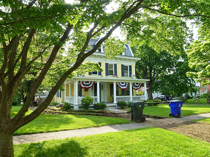 Patriotic bunting and a welcoming porch &ndash; this yellow Victorian beauty isn't from a movie set, it's someone's actual home. Small-town America without the artificial sweetener.