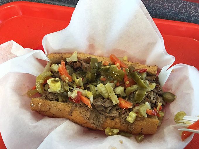 The Italian beef in its natural habitat—swimming in savory jus with giardiniera providing the perfect acidic counterpoint. Napkins are not optional, they're survival gear.