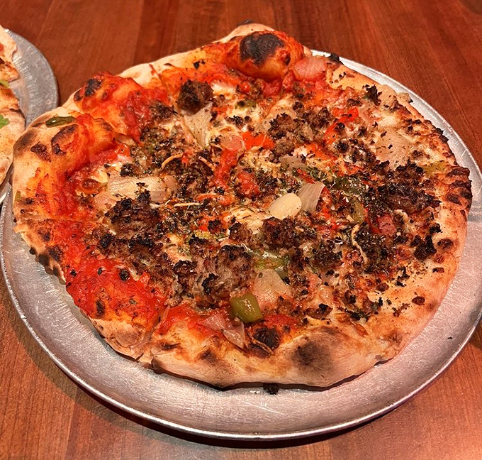 This isn't just pizza with meat - it's a carnivore's sonnet with perfectly charred crust and toppings that know their supporting role.