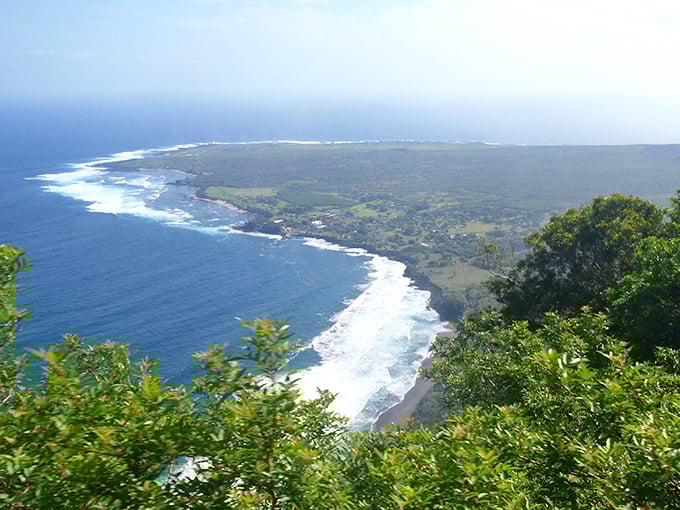 Bird's eye candy: Kalaupapa Peninsula stretches into the Pacific like nature's welcome mat, framed by emerald cliffs and azure waters.