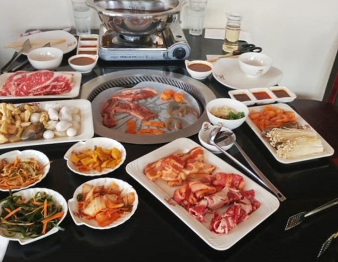 A tabletop symphony of raw ingredients waiting for their hot grill transformation. This isn't just dinner&mdash;it's dinner and a show!