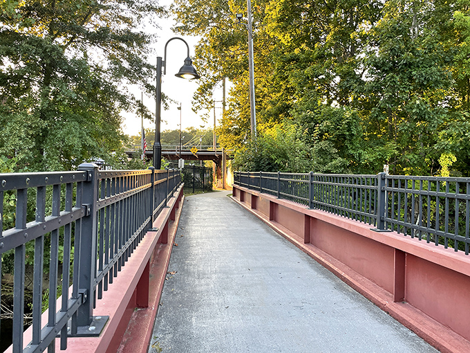 This pedestrian bridge over the Naugatuck River connects neighborhoods while offering serene views. Morning walks here make you forget you're living on a budget, not sacrificing quality of life.