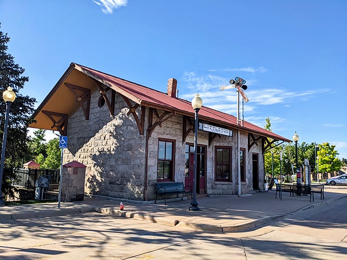 The historic Littleton Downtown Station stands as a stone testament to when train travel was glamorous and not just another Netflix documentary subject.