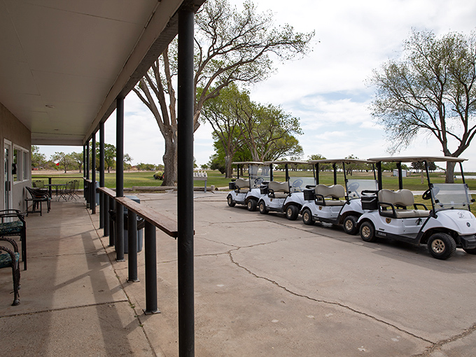 Golf carts stand ready for adventure at Lovington Country Club, where the wide-open spaces remind you you're gloriously far from city traffic.