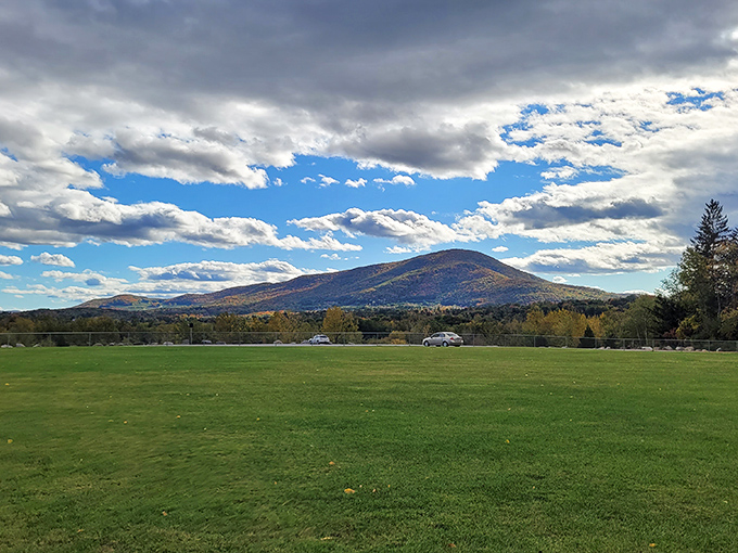 Nature's amphitheater where the Green Mountains perform daily, no tickets required. The kind of vista that makes smartphone cameras feel inadequate.