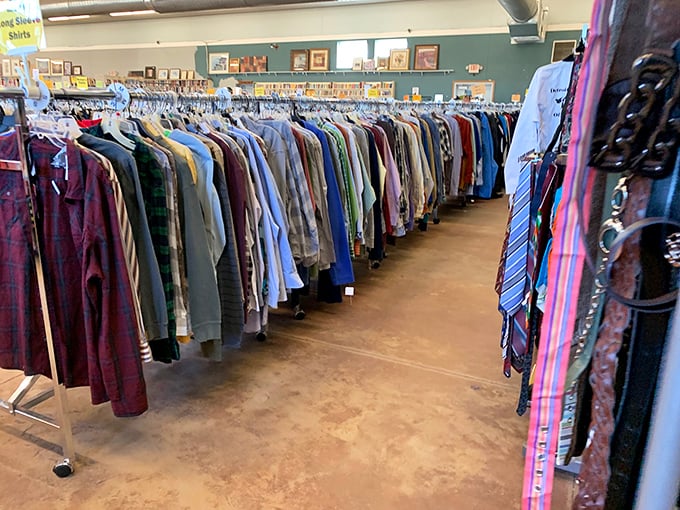 Men's shirts and suits hang with military precision, a rainbow of options for the budget-conscious professional.