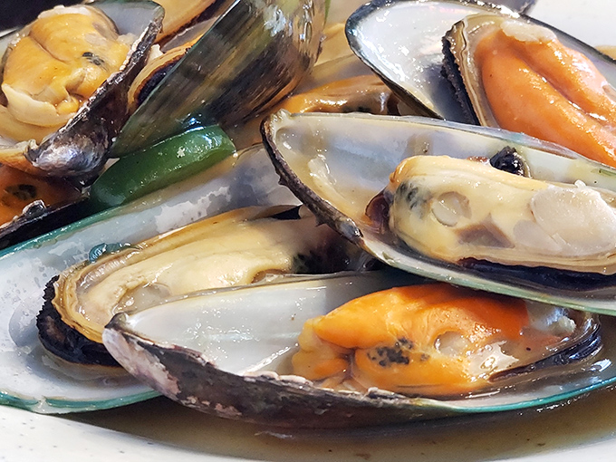 These plump mussels glisten with promise, offering a taste of the sea amid the landlocked Midwest. Ocean-to-table in the most unexpected place.