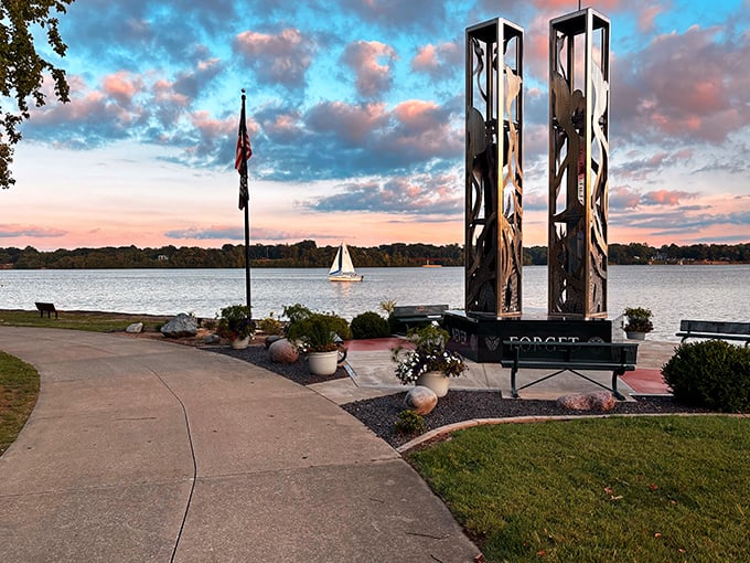 Sunset paints Lake Decatur in watercolor hues as a lone sailboat glides by, proving small-city living doesn't mean sacrificing postcard-worthy moments.