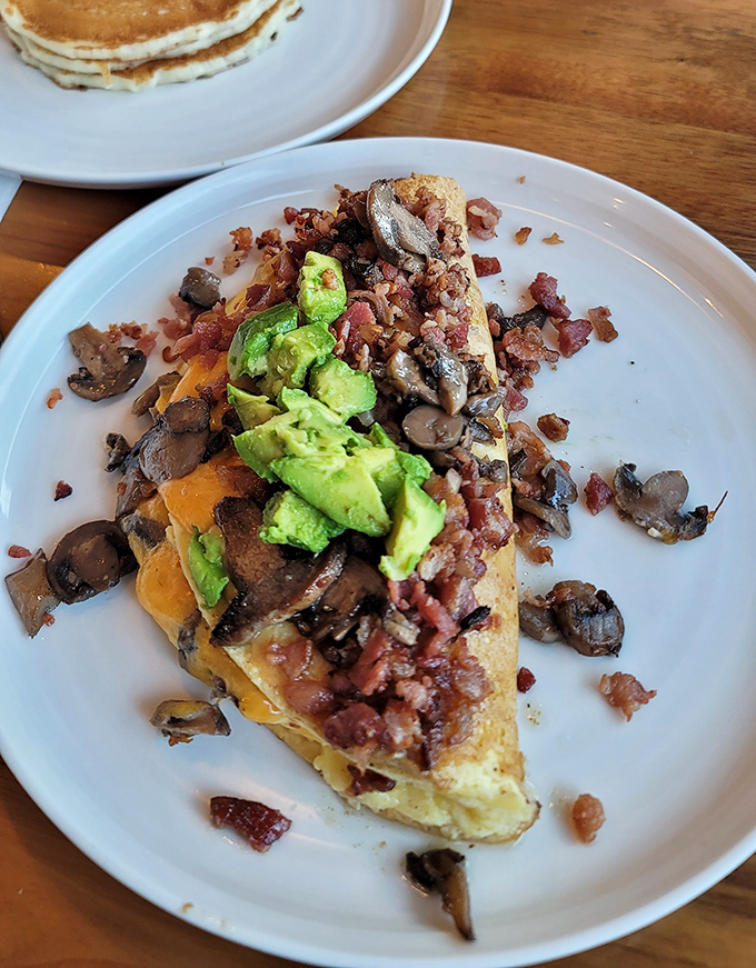 This omelet doesn't just have avocado, mushrooms, and bacon—it has LIFE GOALS. A protein masterpiece that makes other breakfasts look like they're not even trying.