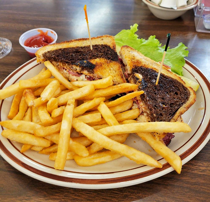 A proper diner sandwich doesn't whisper—it announces itself with golden-brown toast, generous filling, and enough fries to share (but you won't want to).